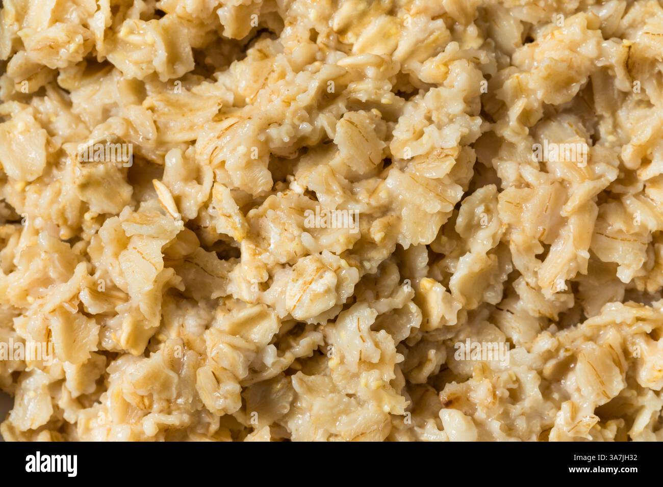 Basic Homemade Rolled Oats Oatmeal in a Bowl for Breakfast Stock Photo - Alamy