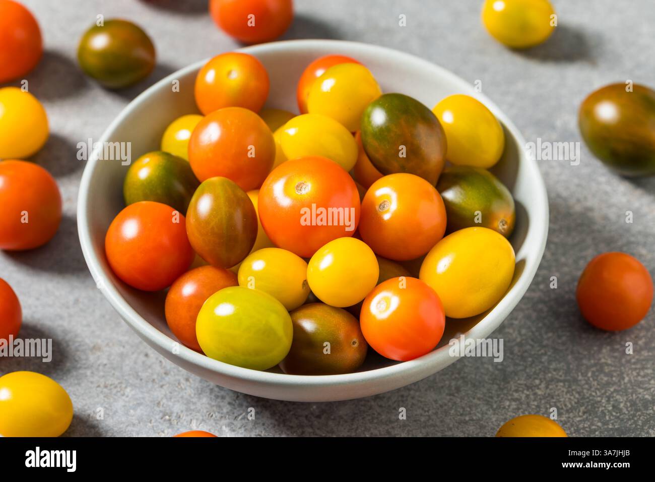 Organic Colorful Heirloom Cherry Tomatoes in a Bowl to Cook Stock Photo - Alamy