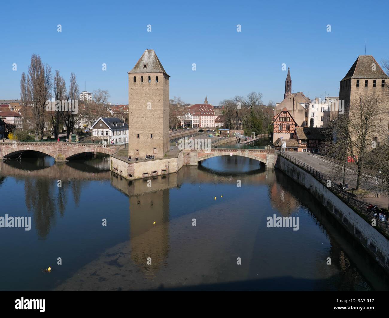 The covered bridges in Strasbourg with historic towers and islands on ...