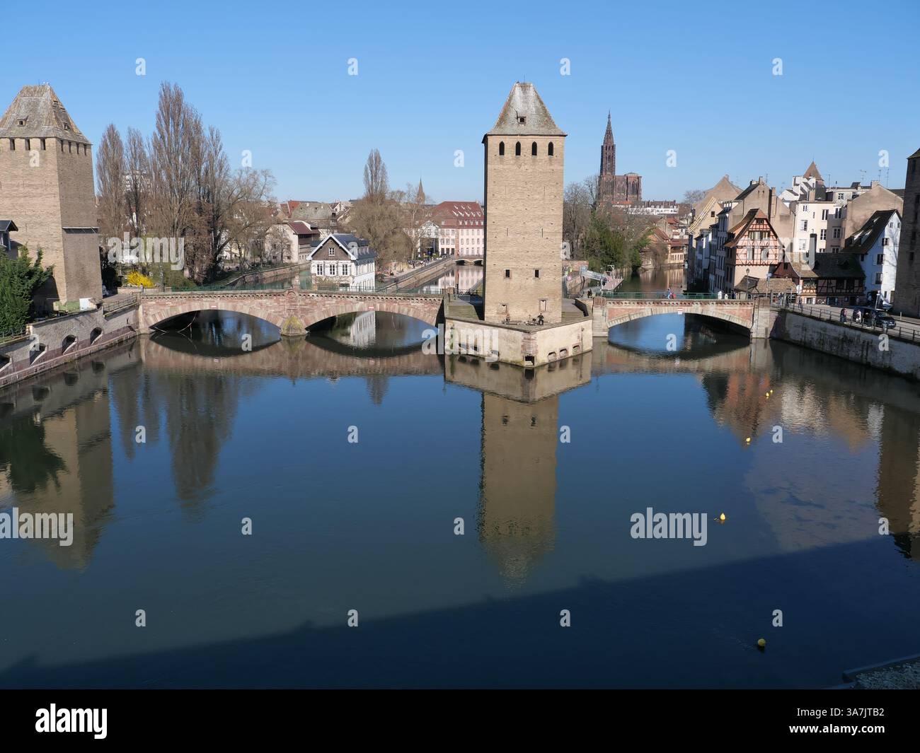 The covered bridges in Strasbourg with historic towers and islands on ...