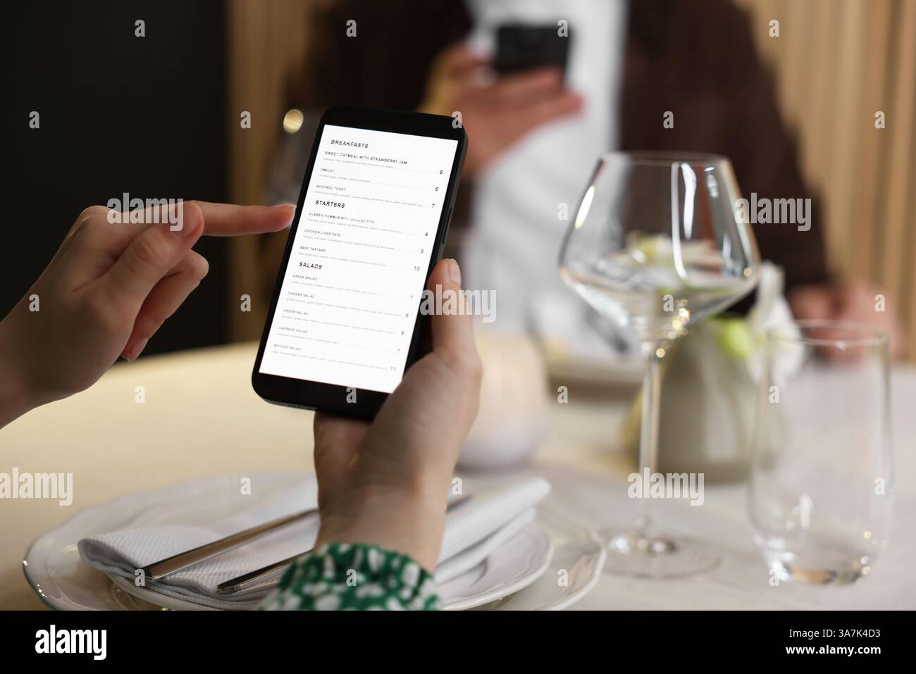 Couple choosing dishes from digital menu at restaurant, closeup Stock ...