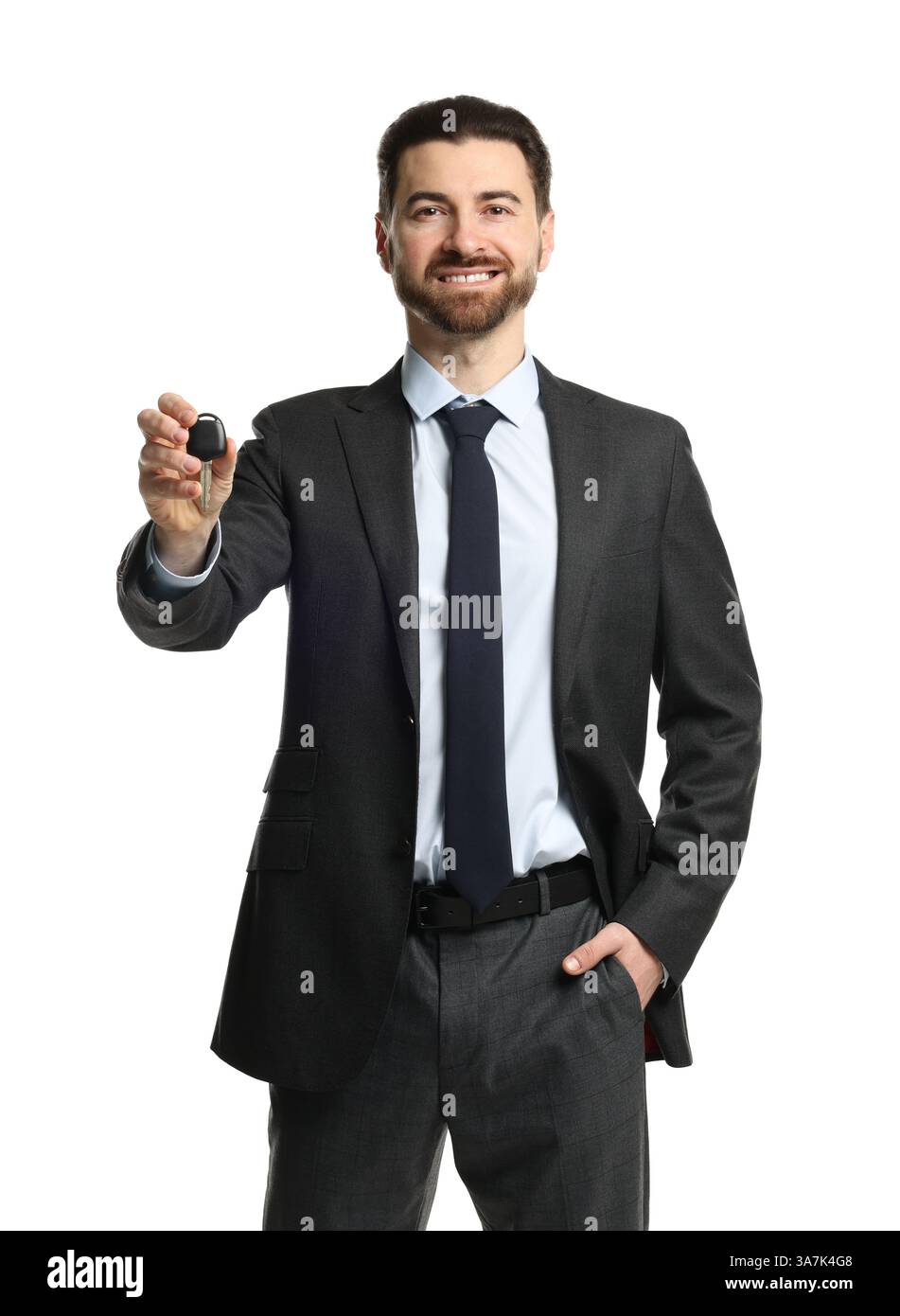 Cheerful salesman with car key on white background Stock Photo - Alamy