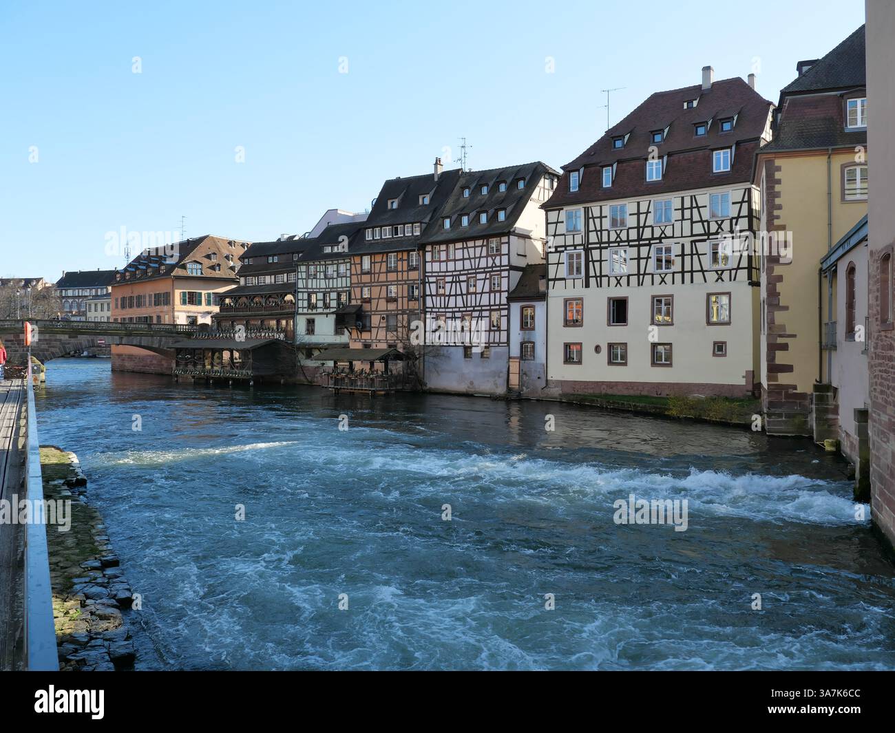 Water flowing out of an Ill canal next to the lock in Petite France in ...