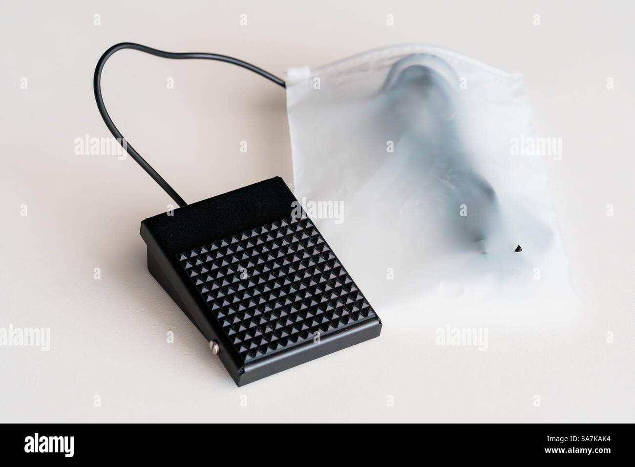 Black Foot Pedal Switch with Attached Cable Inside Transparent Plastic ...
