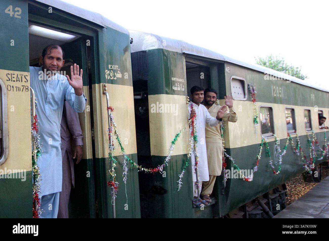 People are boarding on train after re-inauguration of the Jaffar ...