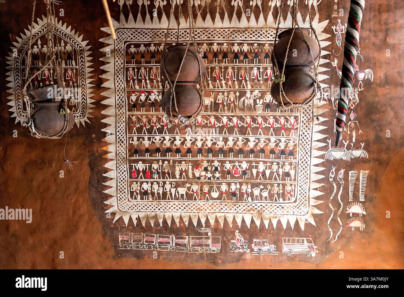 Traditional paintings, drawings on a wall of a mud house from Lanjia ...