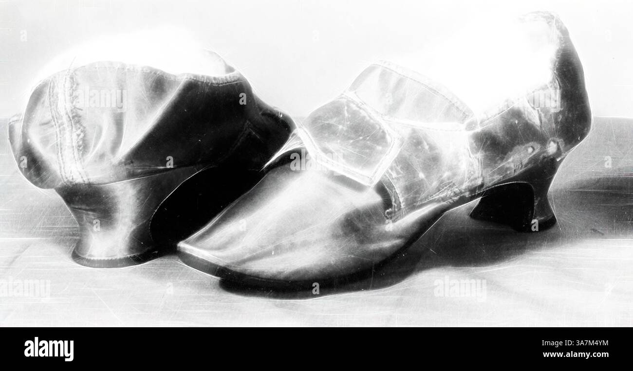 A pair of vintage high-heeled shoes featuring a sleek design and a ...