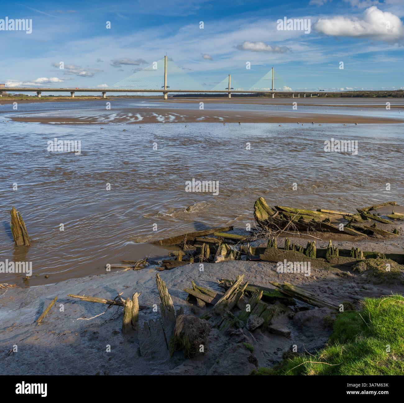 The river Mersey at Widnes with the Mersey Gateway bridge in the back ...