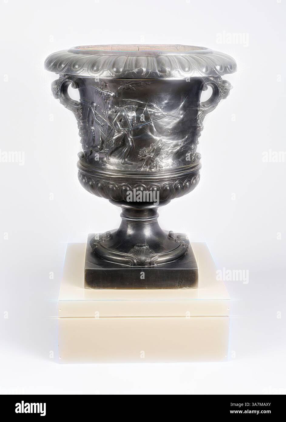 An ornate black urn featuring intricate carvings, with decorative ...