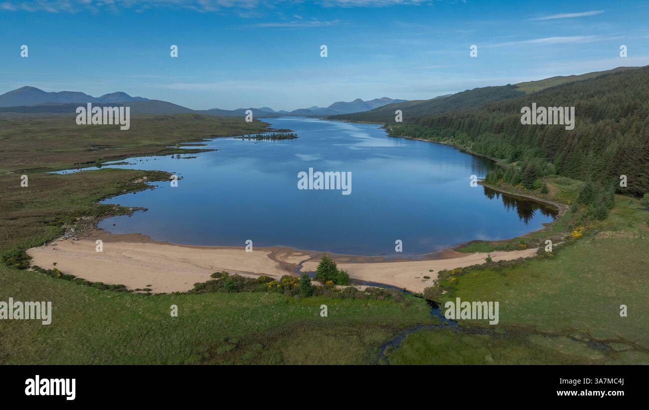 The beach at Loch Laidon with the view across Rannoch Moor in the ...