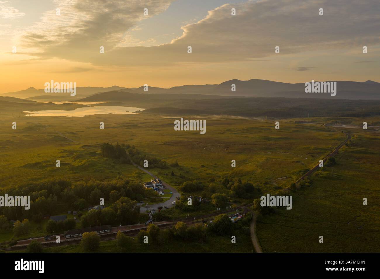 Rannoch Station in the morning sun with the view across Loch Eigheach ...