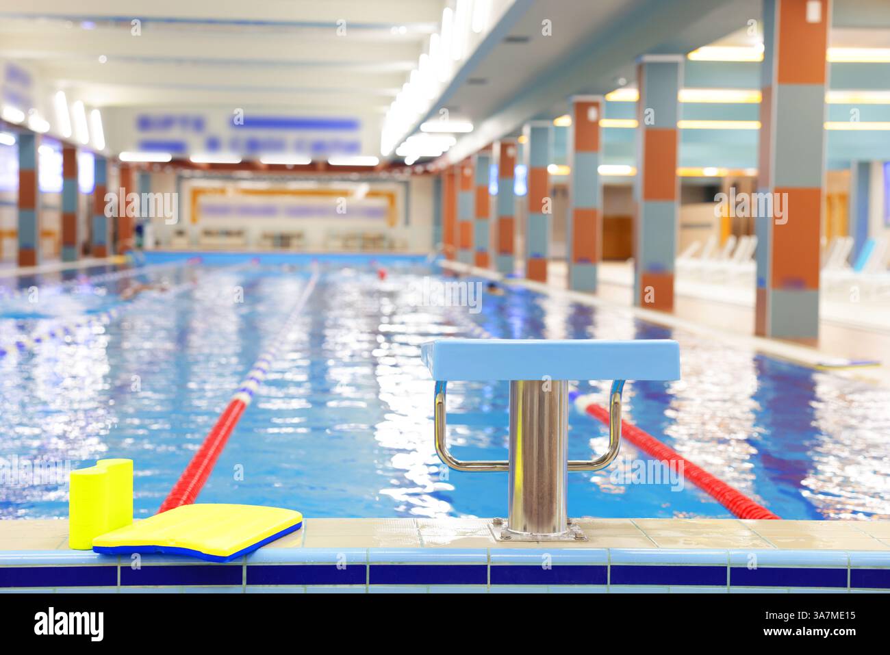 Swimming pool with clean water and lane dividers indoors Stock Photo ...