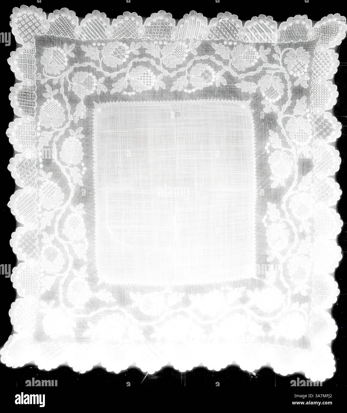 A delicate lace handkerchief featuring intricate floral patterns and a ...