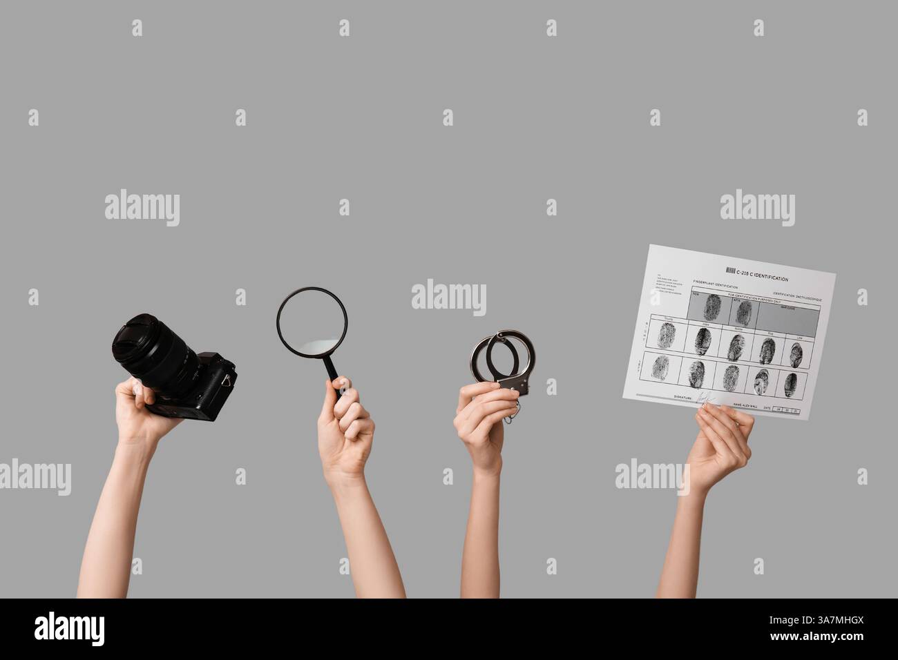 Women with accessories of detective on grey background Stock Photo - Alamy