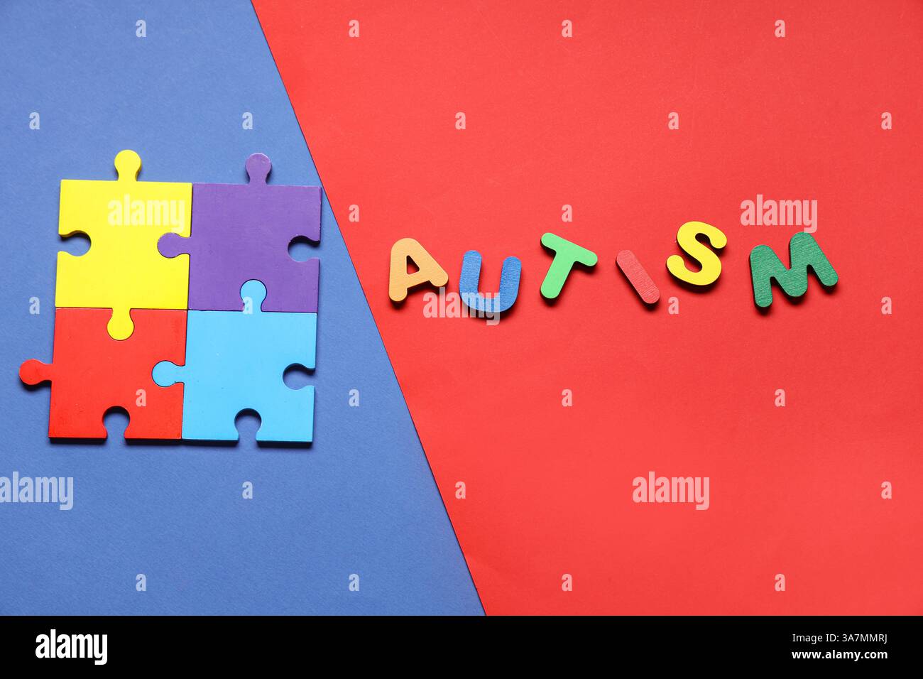 Word AUTISM with puzzle pieces on color background. Autistic disorder ...