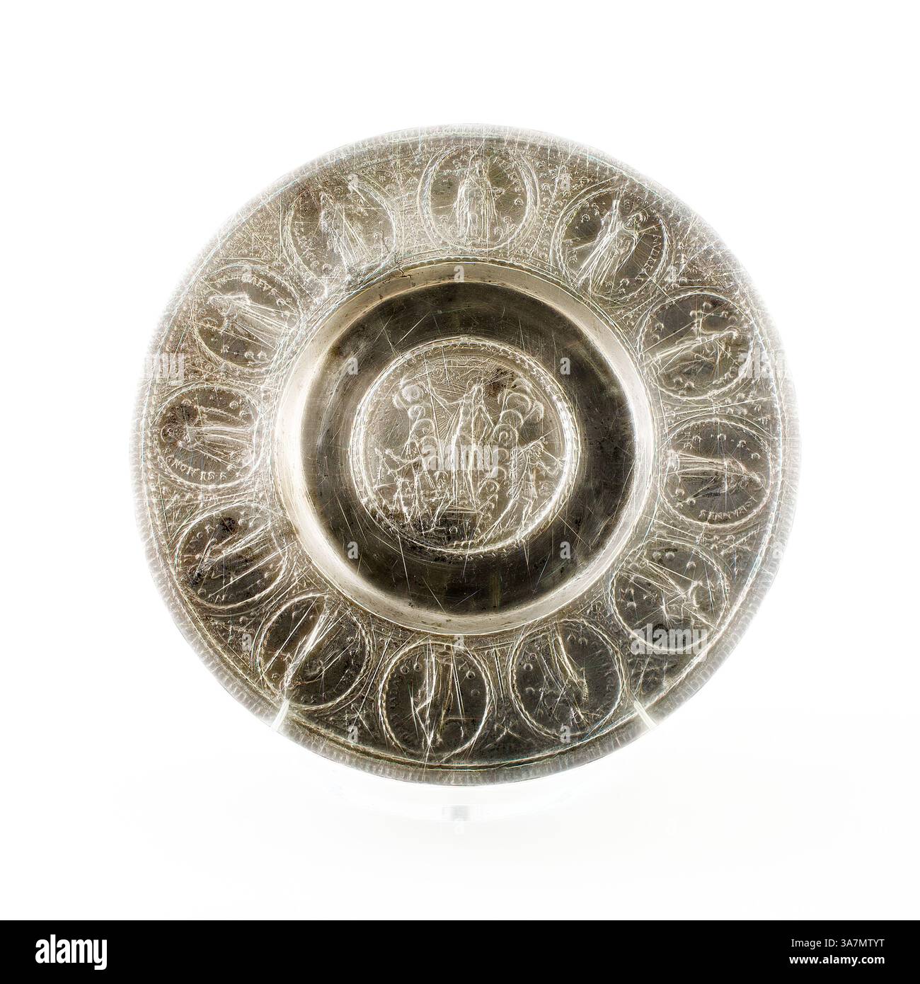 A decorative plate featuring intricate engravings of various figures ...