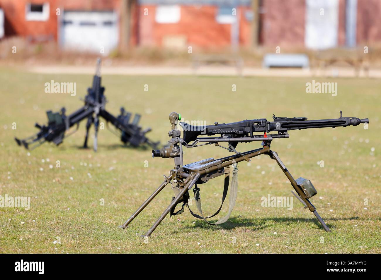 Kiel, Germany. 27th Mar, 2025. Machine guns stand on a lawn at the naval base in Kiel. During a ...