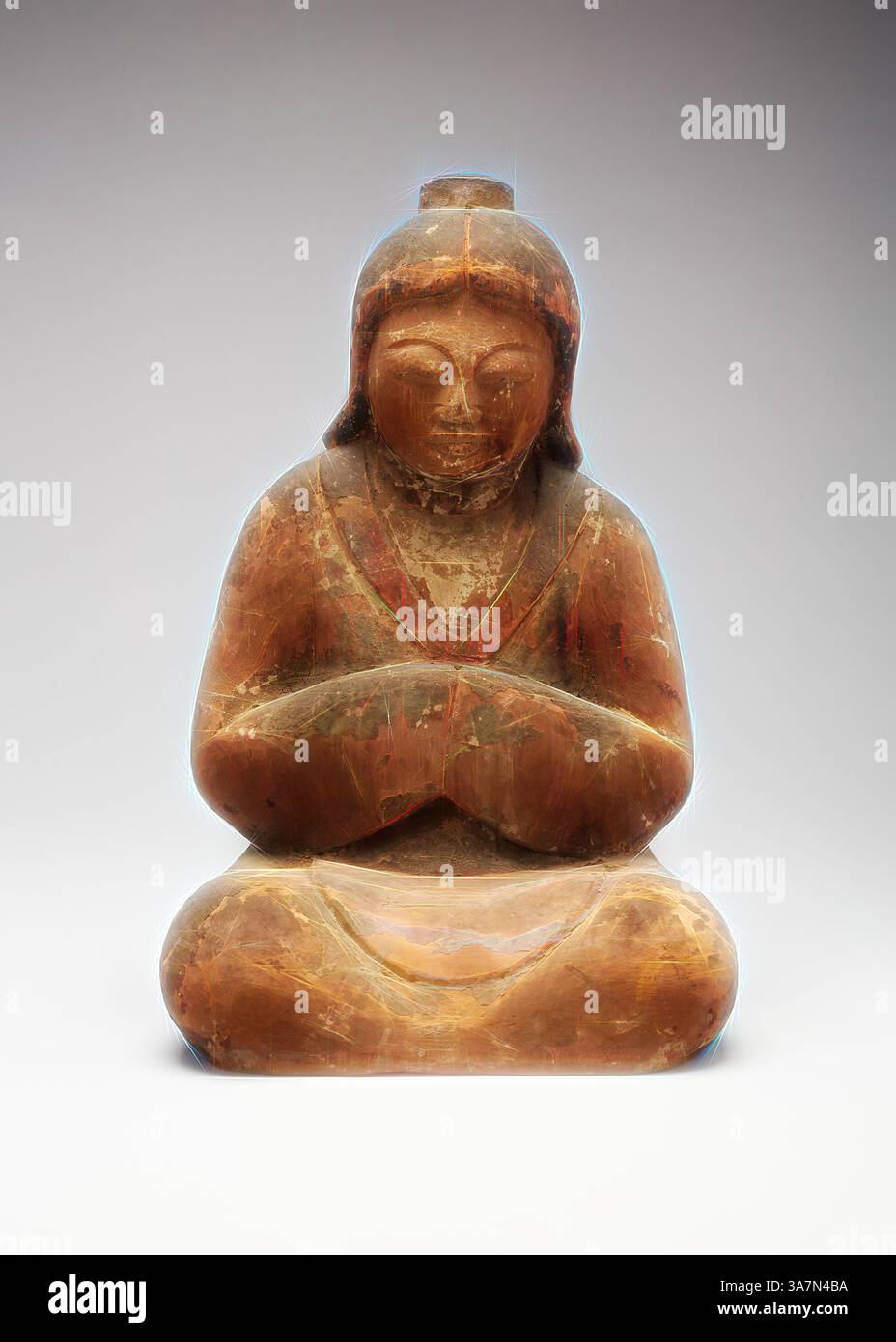 A serene seated figure, featuring intricate details of folded hands and ...