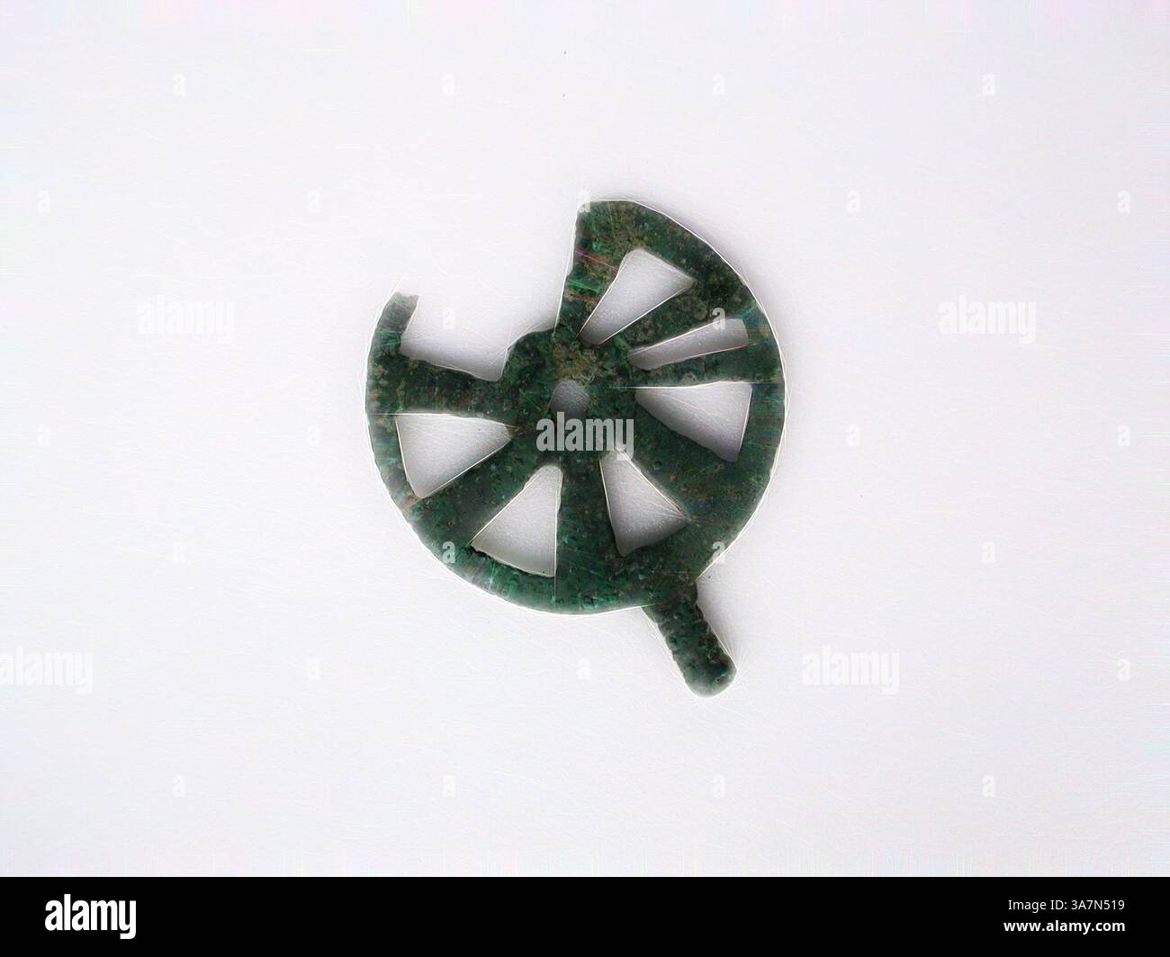 An intricately designed bronze artifact resembling a wheel or circular ...