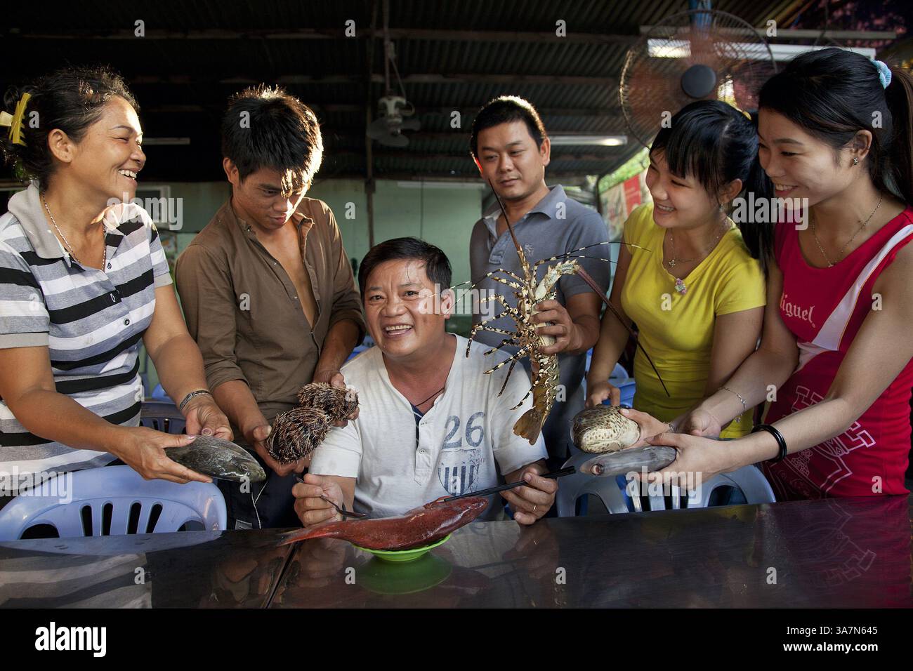 Sept. 24, 2012 - Nha Trang, VNM - Chef Khai Duong is surrounded by ...