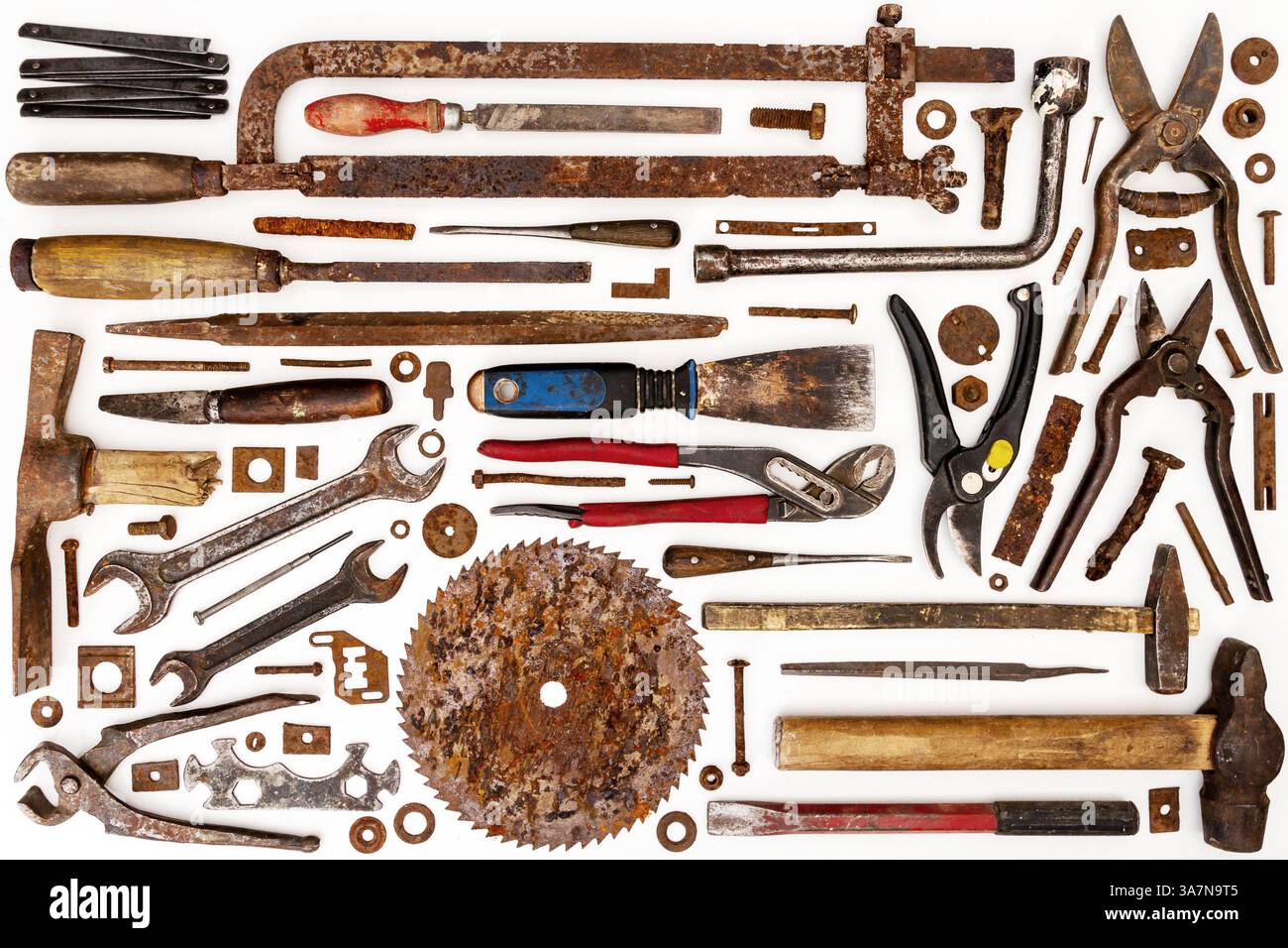 Flat lay of old hand tools on white background. Large collection of various rusty tools and bits ...
