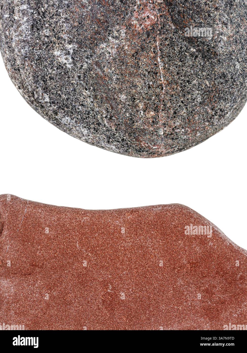 Edges of two pebbles isolated on white background with a space for text ...