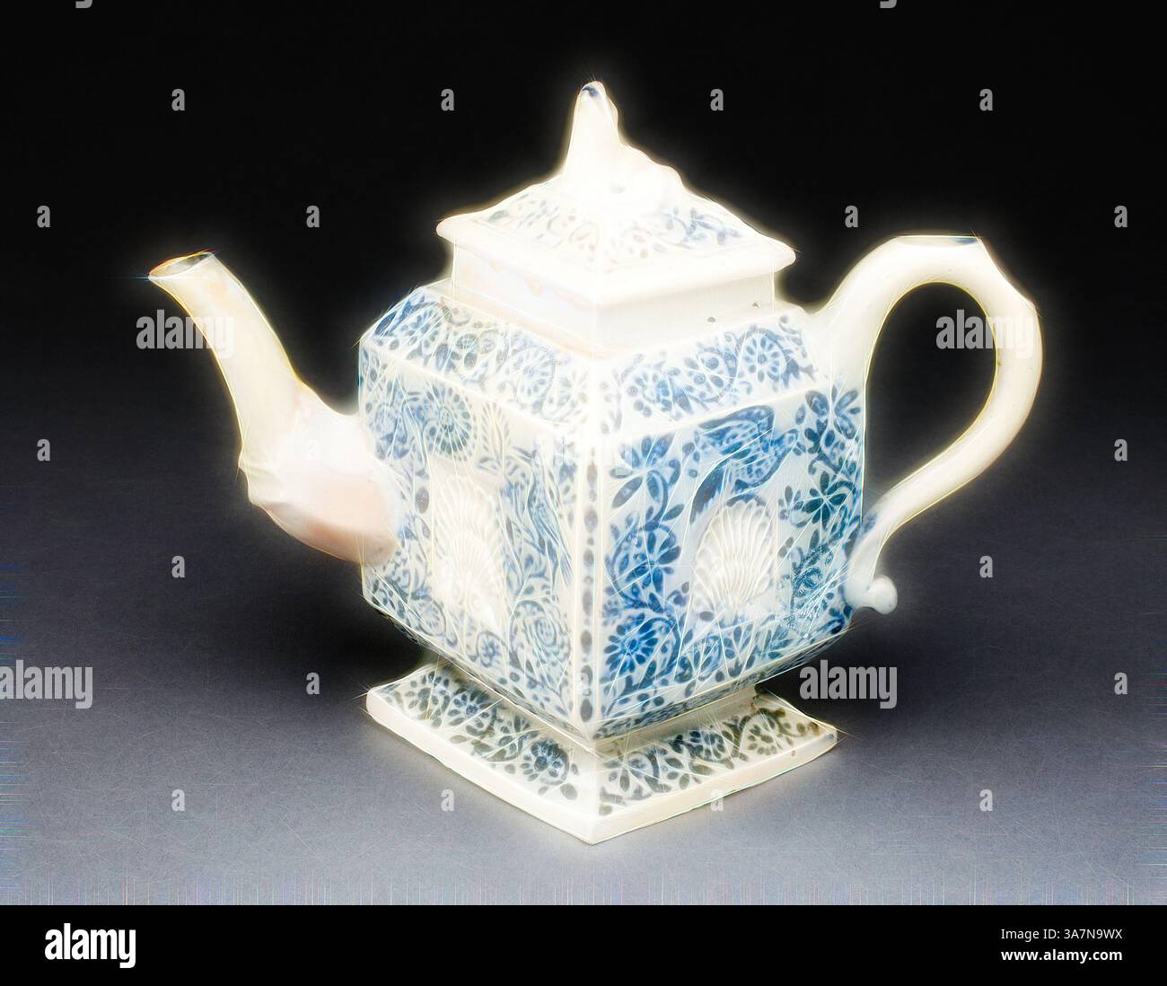 An intricately designed teapot features a square body adorned with ...