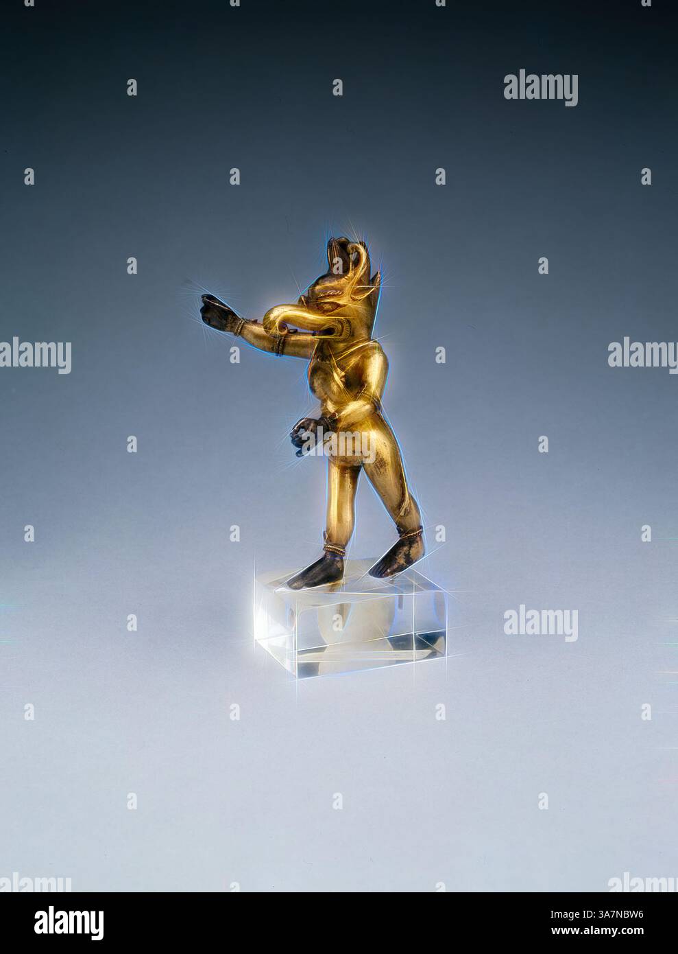 A golden figurine of a humanoid figure with a canine-like head ...