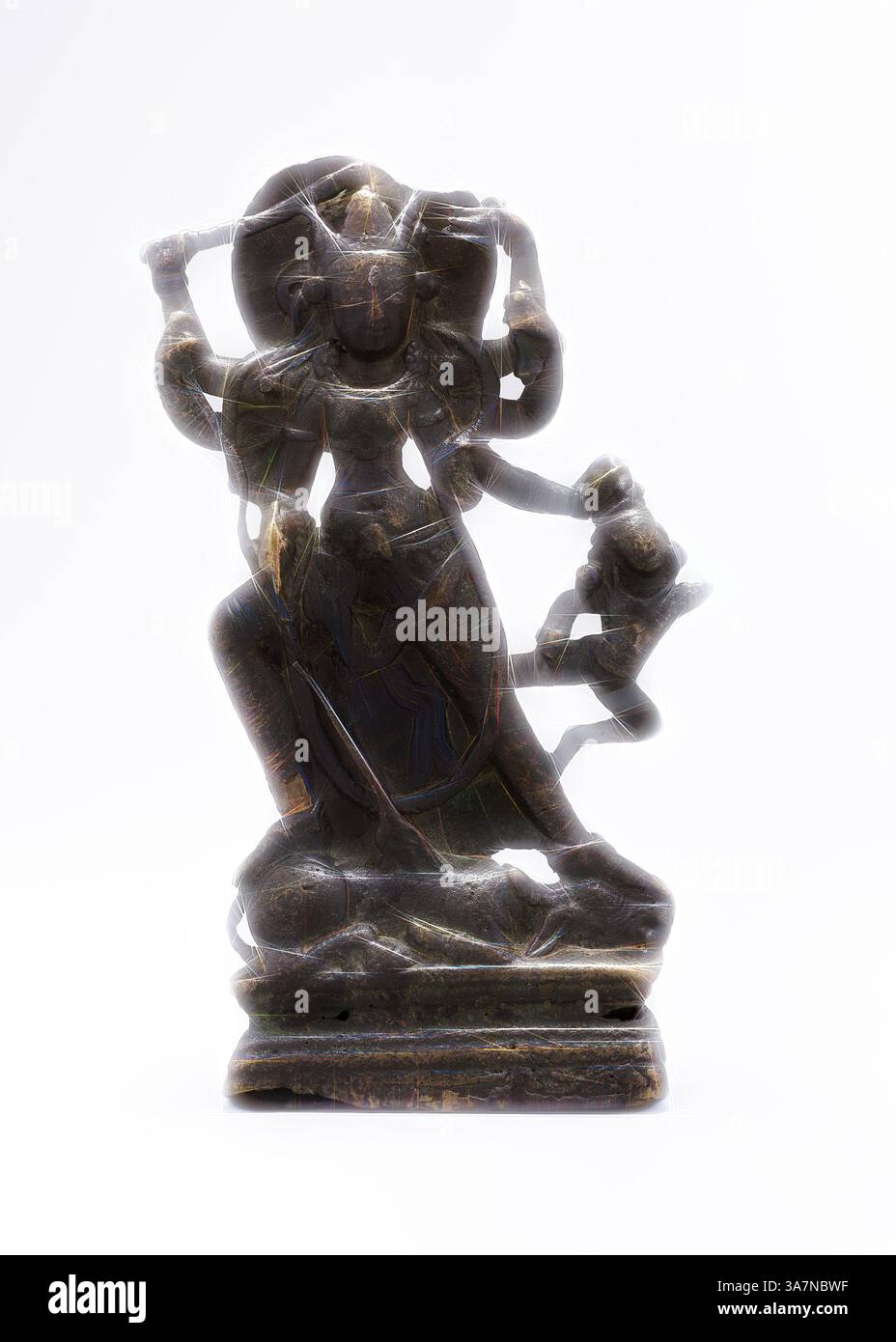 A intricately carved statue depicting a dynamic figure with flowing ...