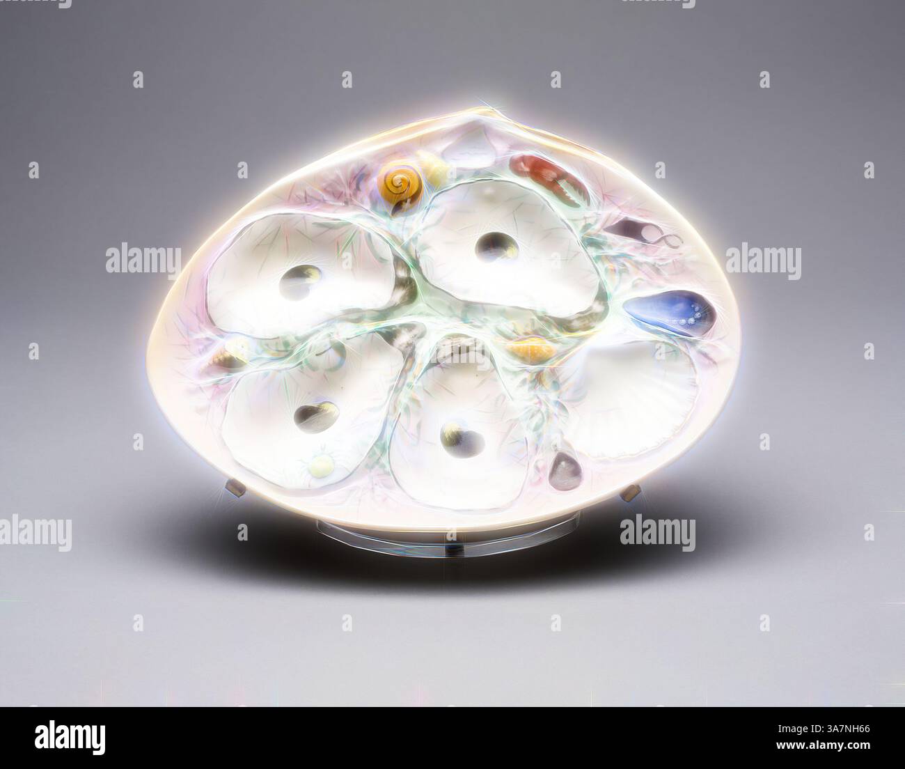 A beautifully crafted shell-shaped dish, decorated with delicate ...