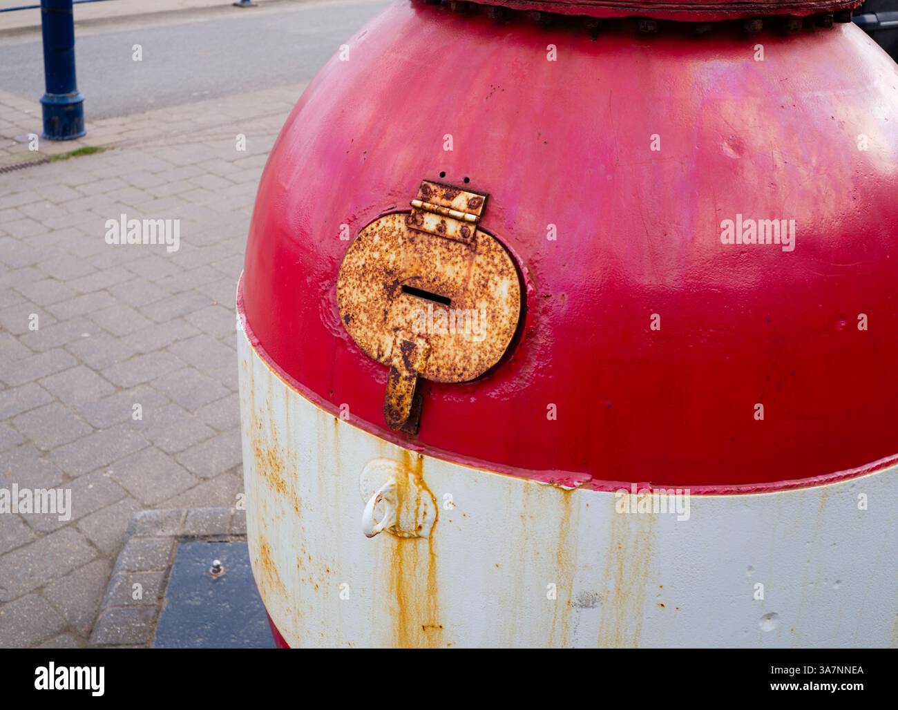 Money slot on sea mine in Filey Stock Photo - Alamy