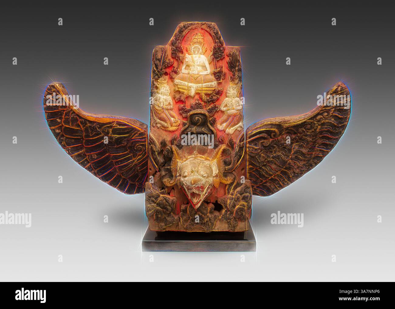 A striking sculpture featuring a central figure seated in a meditative ...