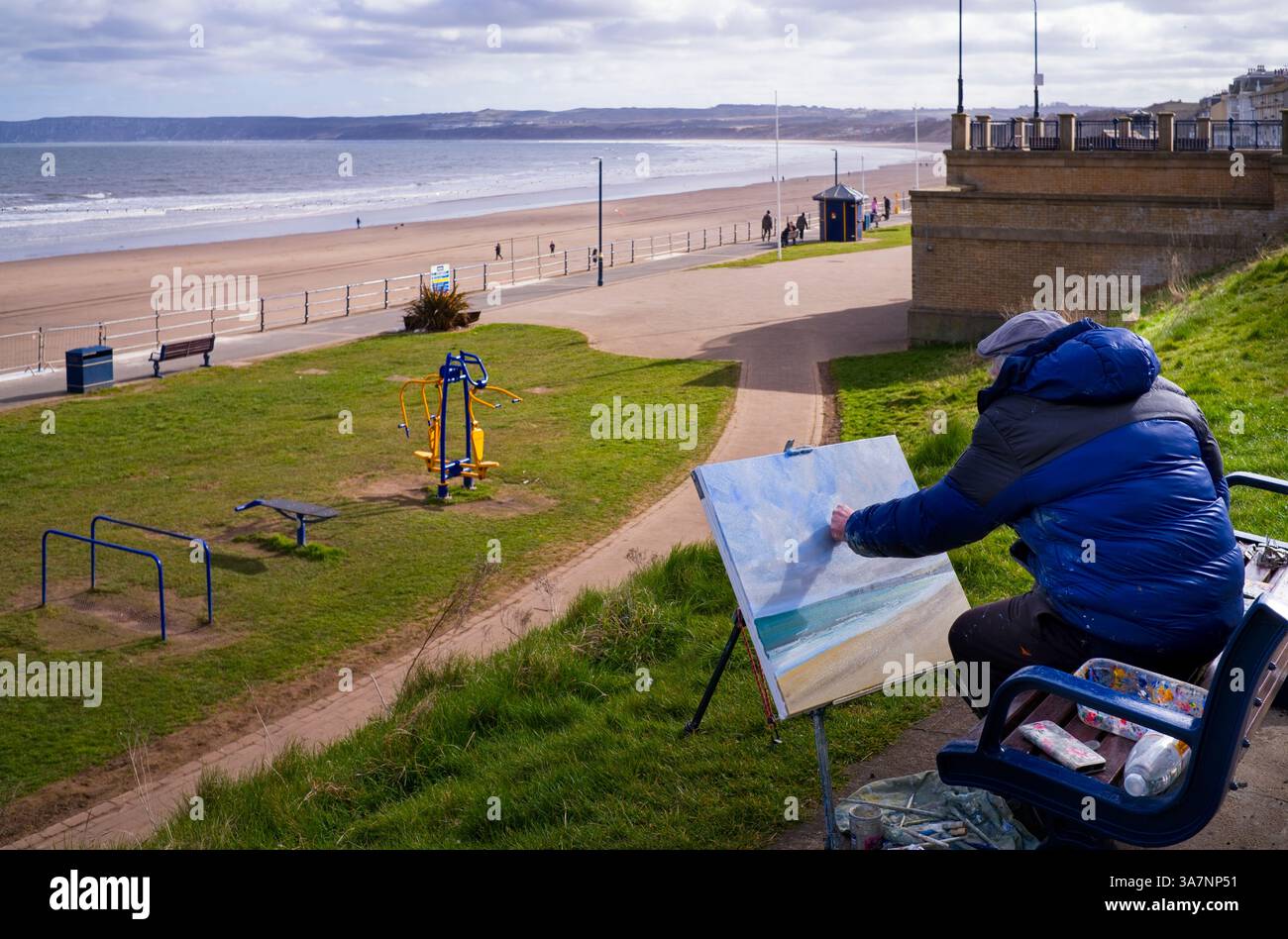 Artist at work painting scene at Filey Stock Photo - Alamy