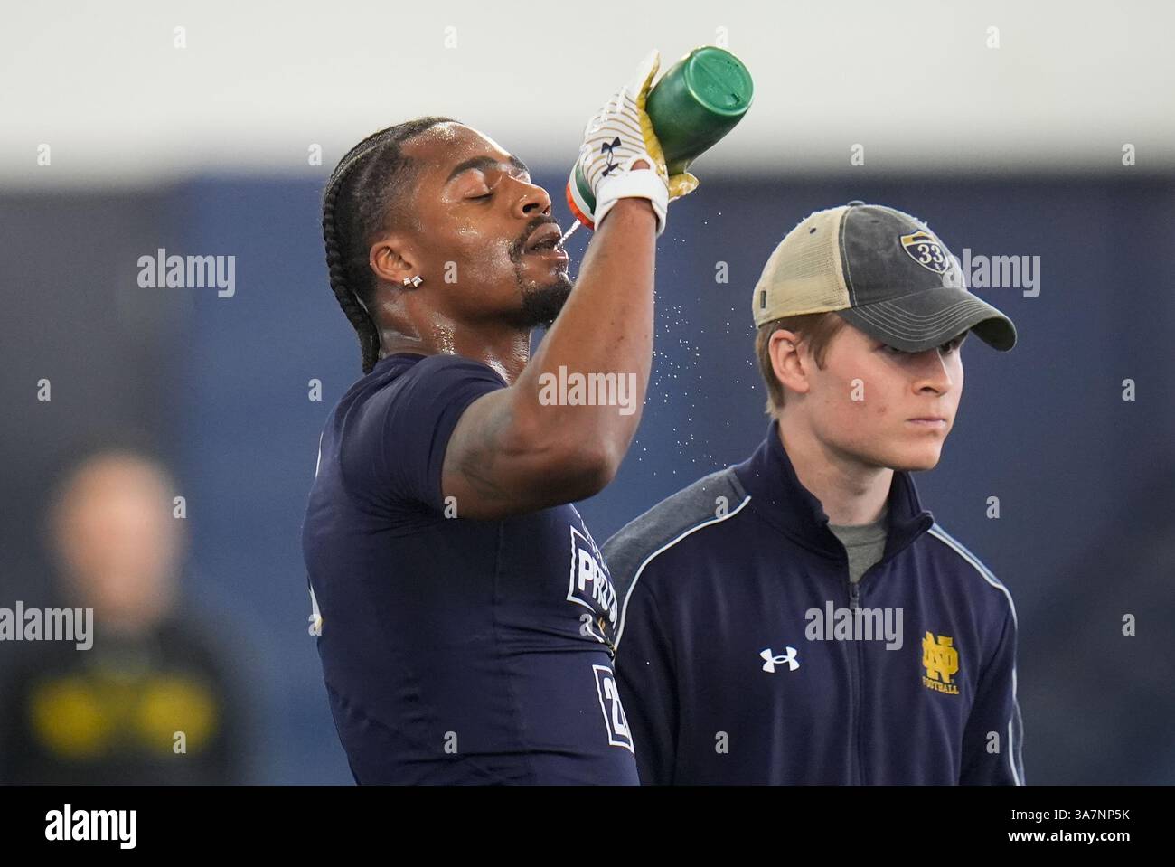 Notre Dame running back Devyn Ford (22) takes a drink during the school ...