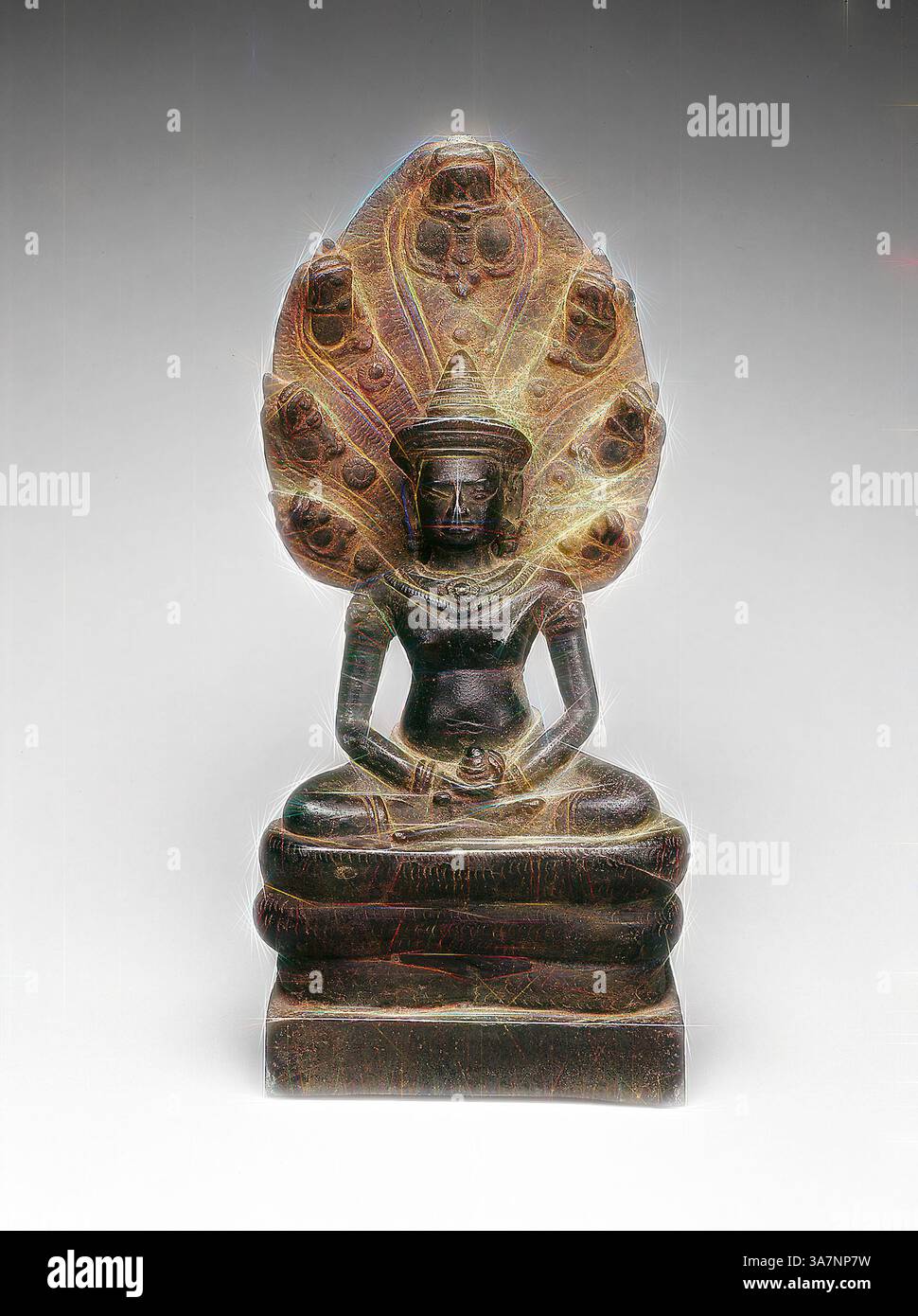 A serene statue of a seated figure adorned with a halo of intricate ...