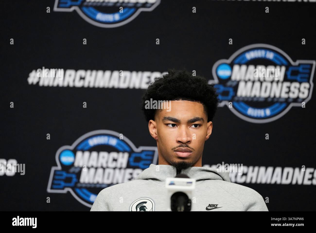 Michigan State guard Jaden Akins (3) speaks during a news conference ...