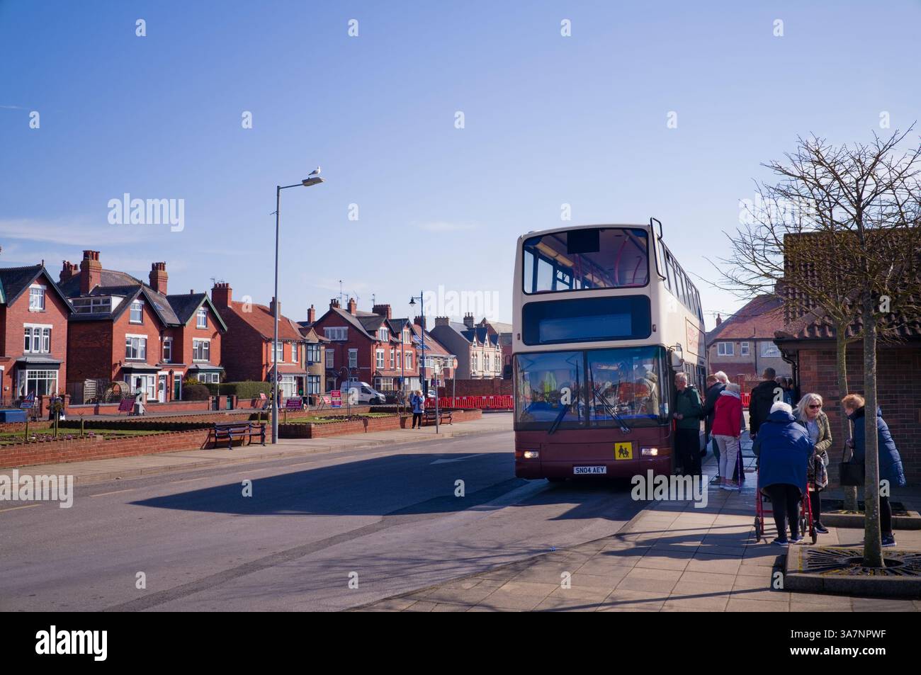 Passengers about to board the 555 bus to Scarborough from Filey bus ...