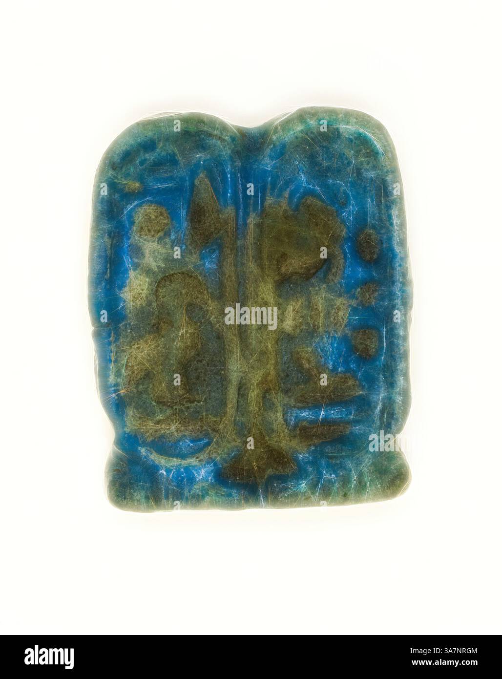 An intricately carved stone artifact featuring abstract designs in ...