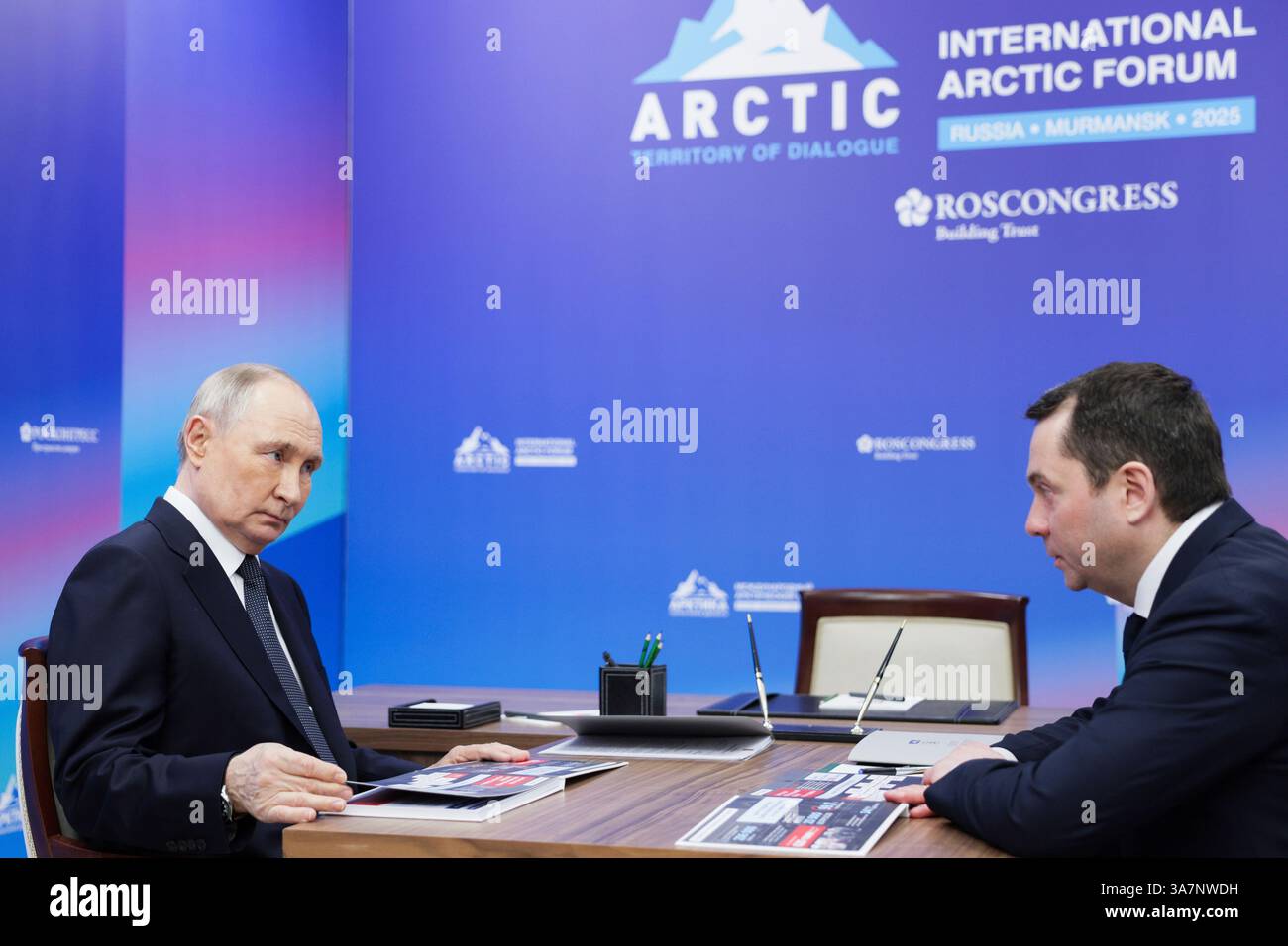 Russian President Vladimir Putin, left, speaks with the governor of ...