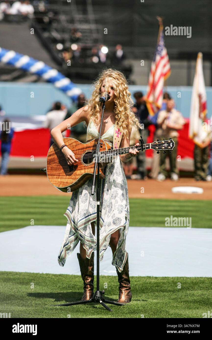 Country singer Taylor Swift sings the national anthem before a baseball ...