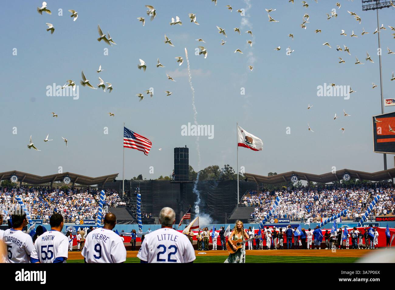 Country singer Taylor Swift sings the national anthem before a baseball ...