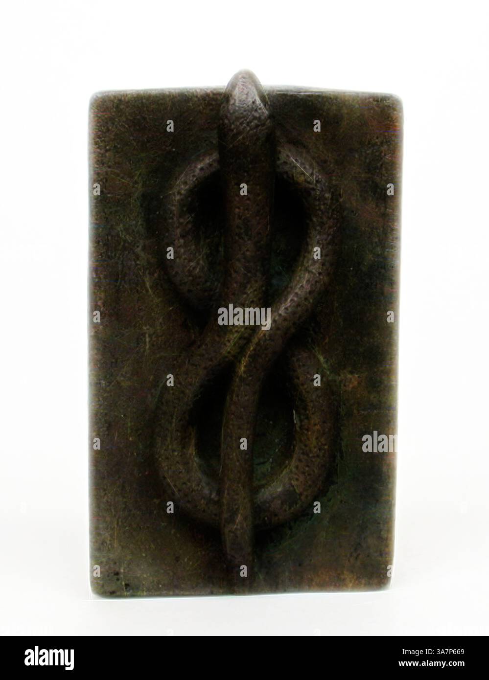 A textured sculpture features a stylized infinity symbol intertwined ...