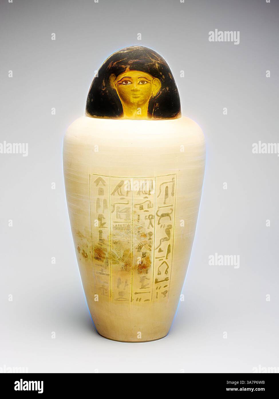 An ancient Egyptian canopic jar, featuring intricately carved ...