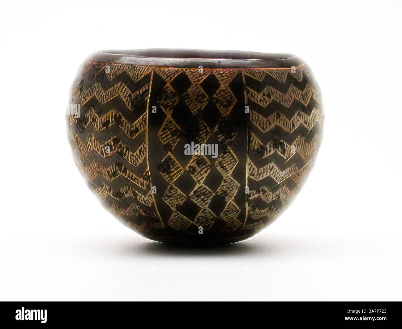 A beautifully crafted ceramic bowl featuring intricate geometric ...