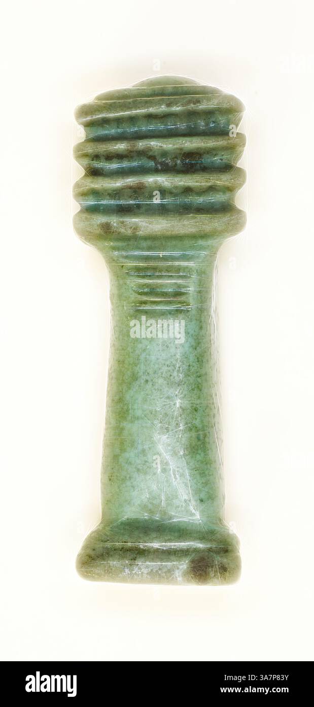 An intricately carved artifact resembling a stylized kohl container ...