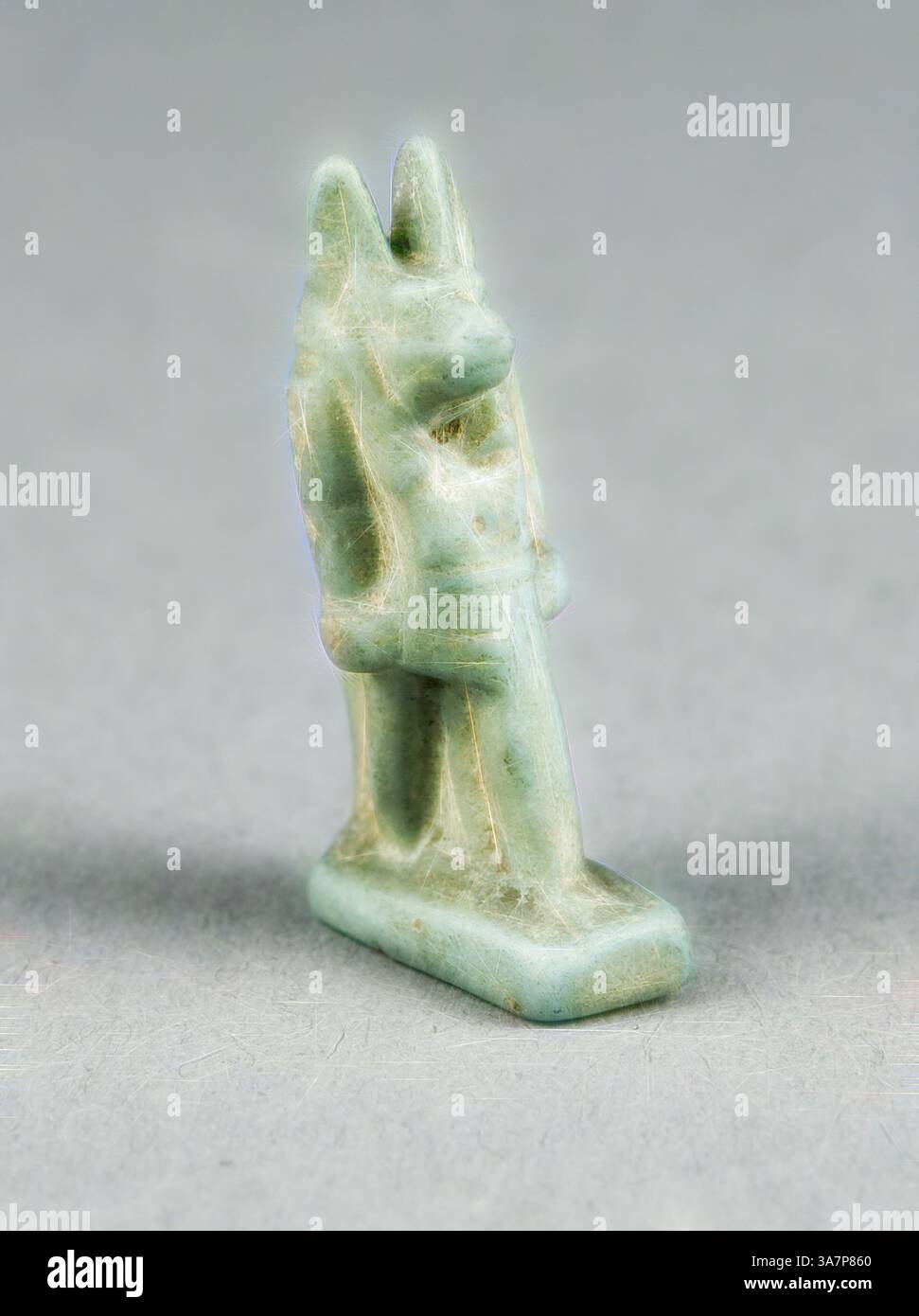 A small figurine depicting the ancient Egyptian god Anubis ...