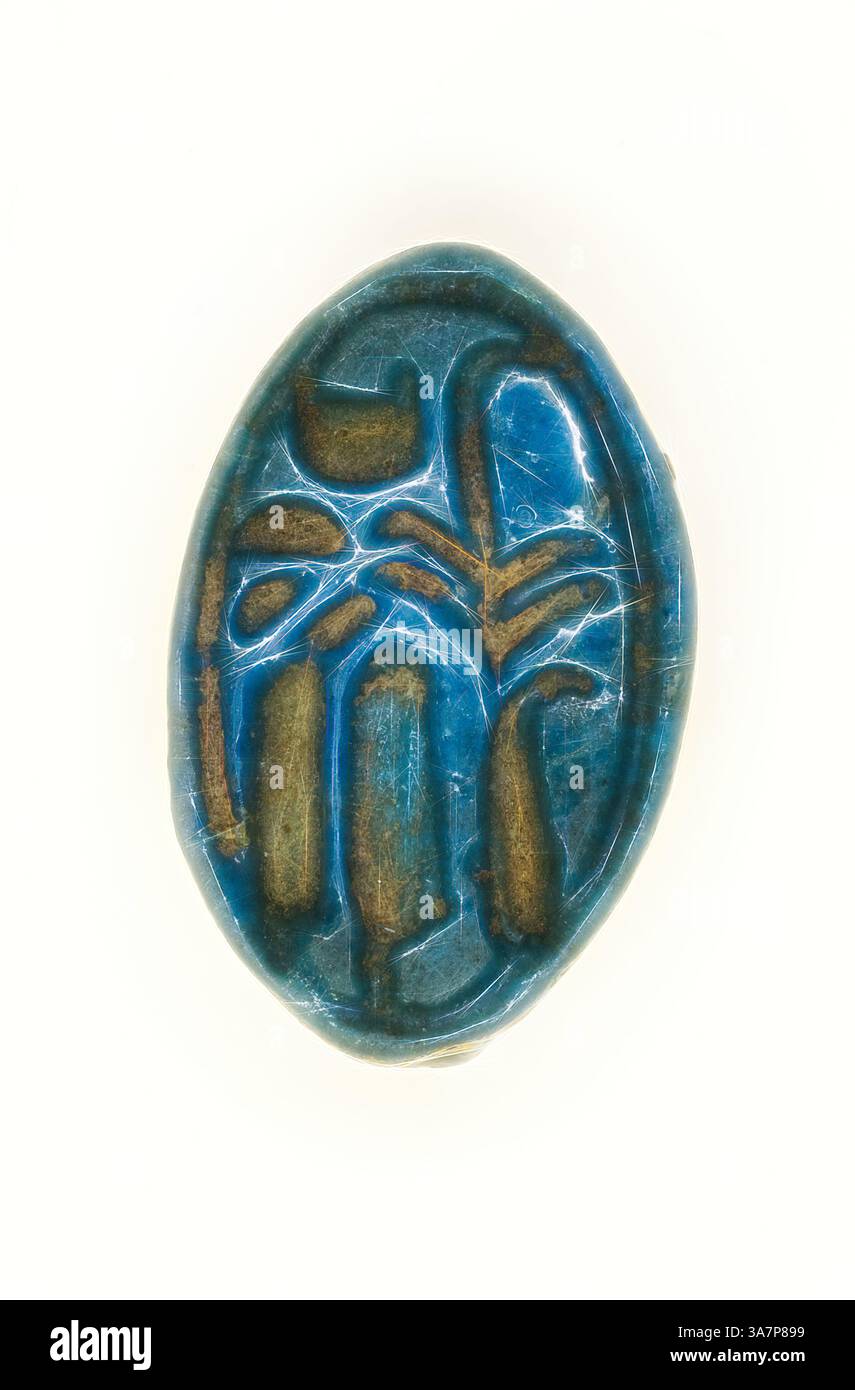 An intricately carved blue lapis lazuli seal featuring stylized figures ...