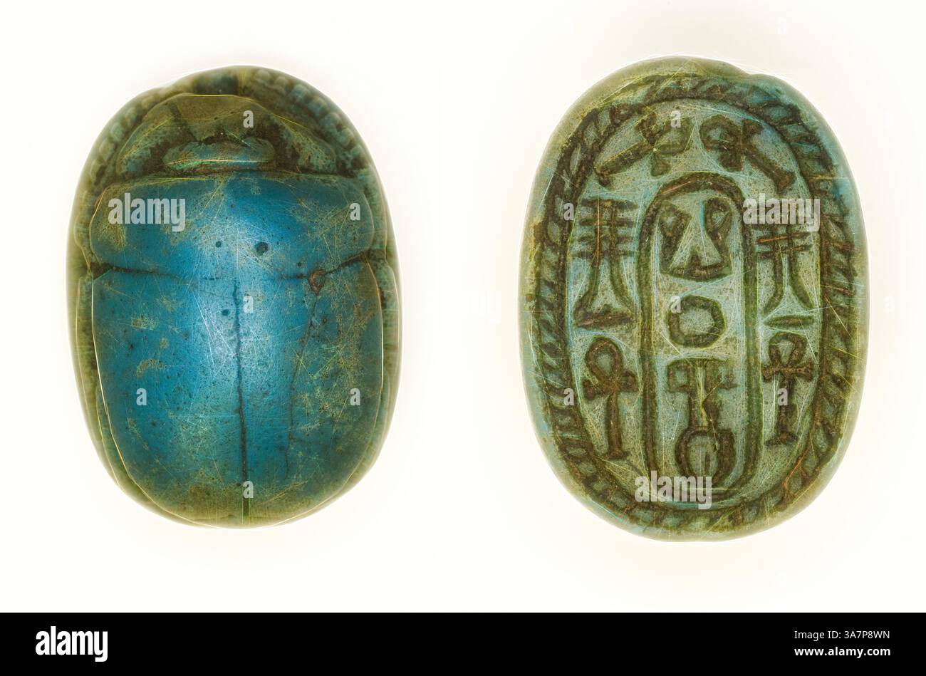 An intricately carved scarab beetle made from vibrant turquoise ...