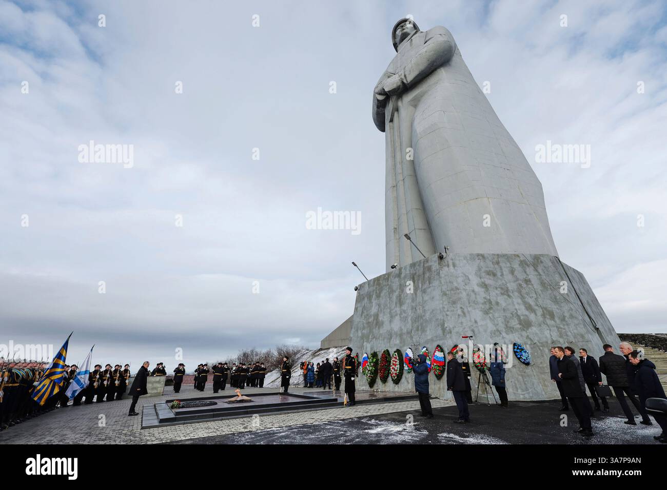 Russian President Vladimir Putin, left, attends a flower-laying ...