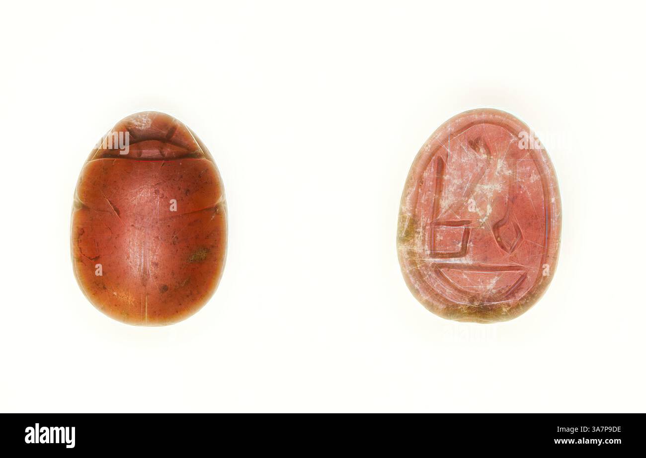 Two intricately carved scarab amulets display vibrant colors and ...